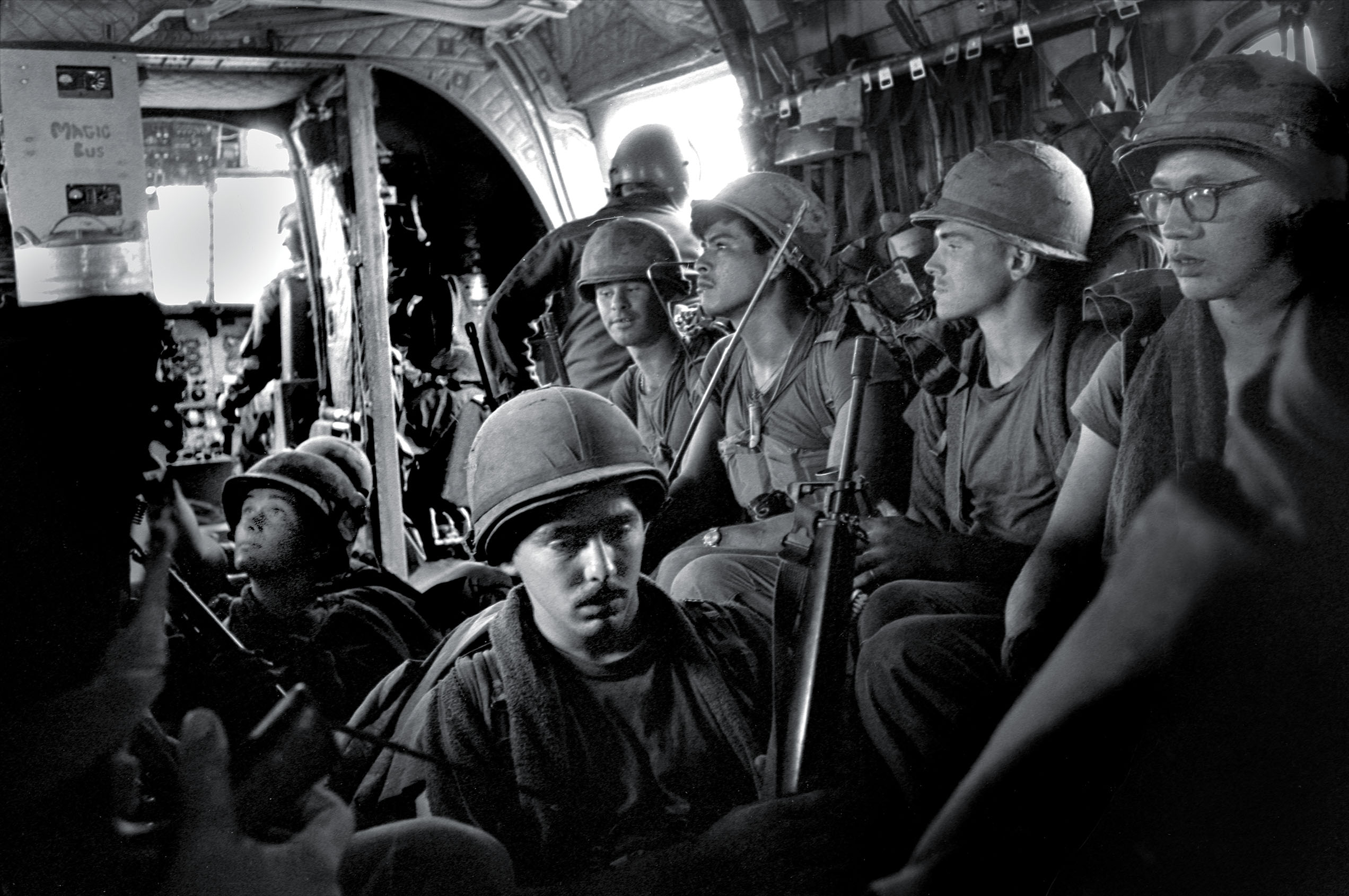 Members of Alpha Company and others fly to the field aboard a CH-47 ...